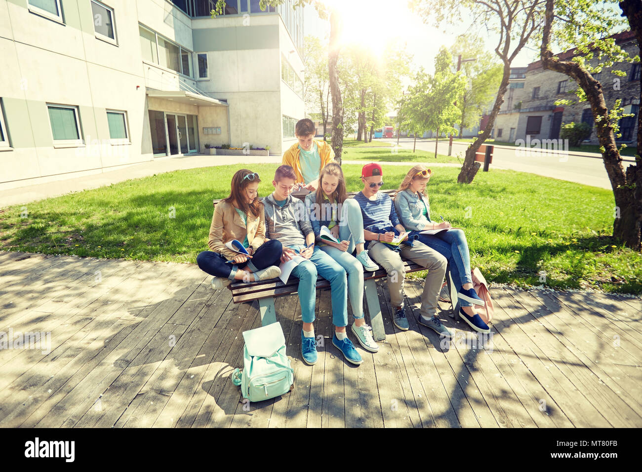 group of students with notebooks at school yard Stock Photo - Alamy