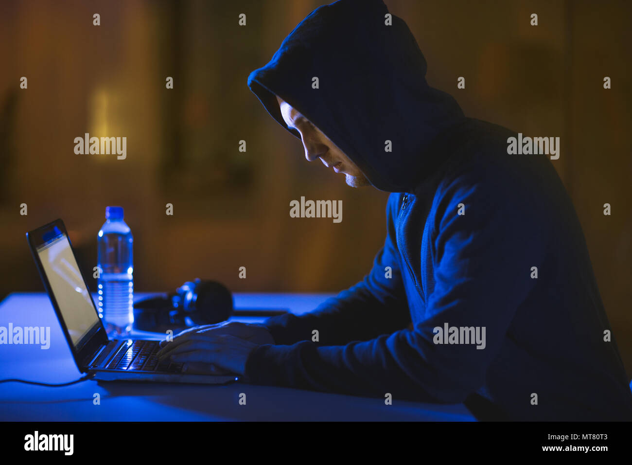 Hacker using laptop blank hi-res stock photography and images - Alamy