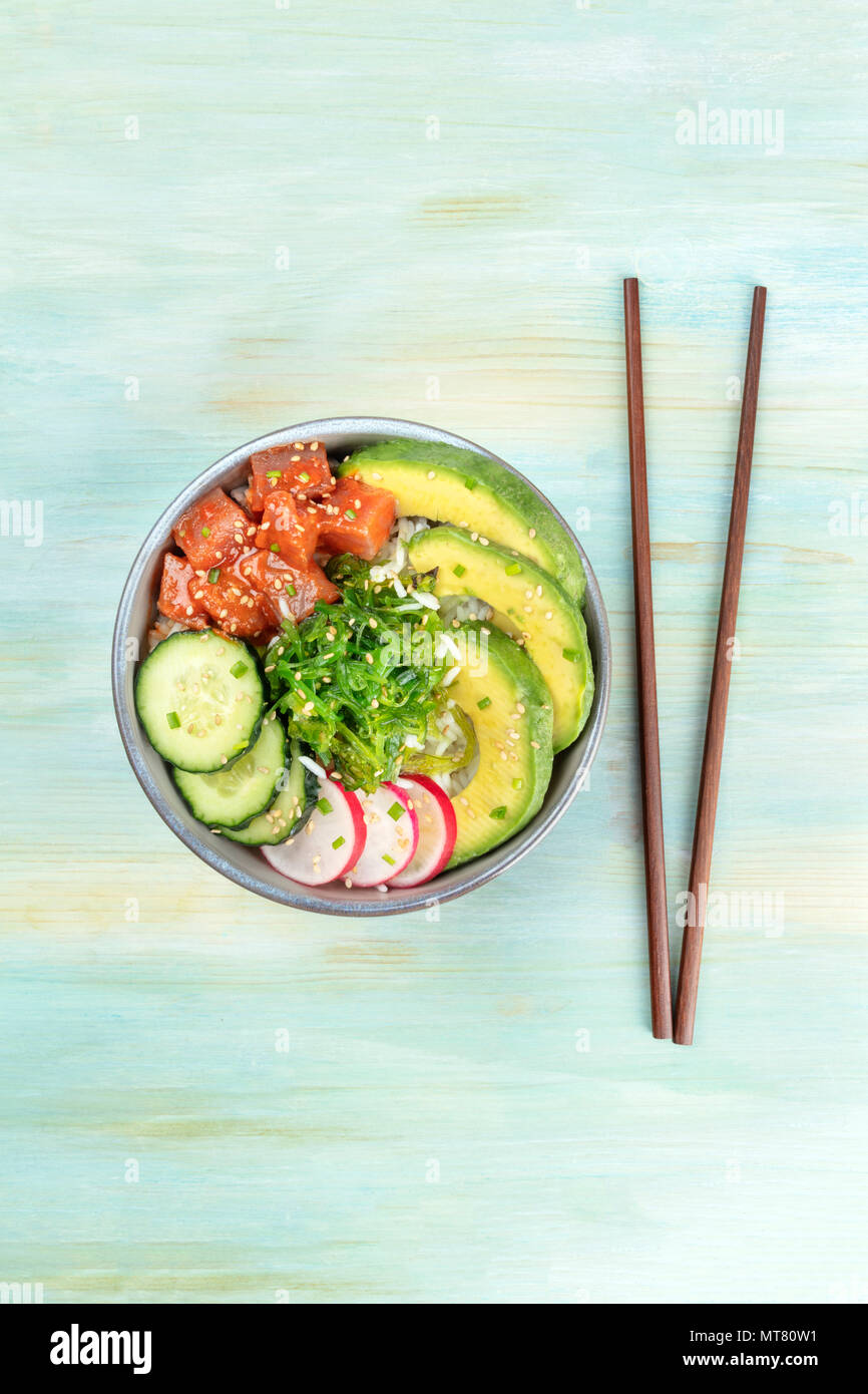 An overhead photo of poke, traditional Hawaiian raw fish salad, with a ...
