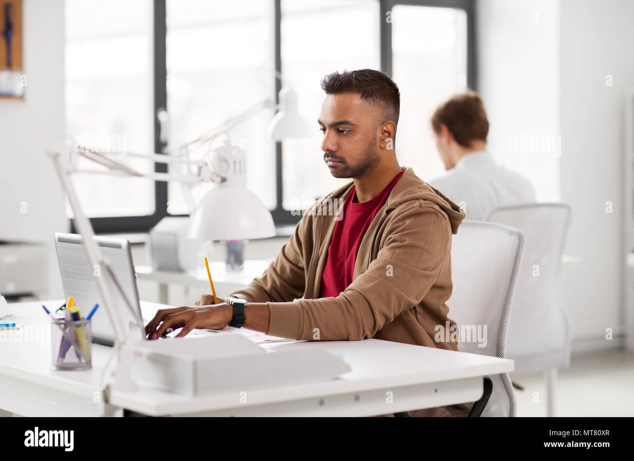 indian man with laptop computer at office Stock Photo - Alamy
