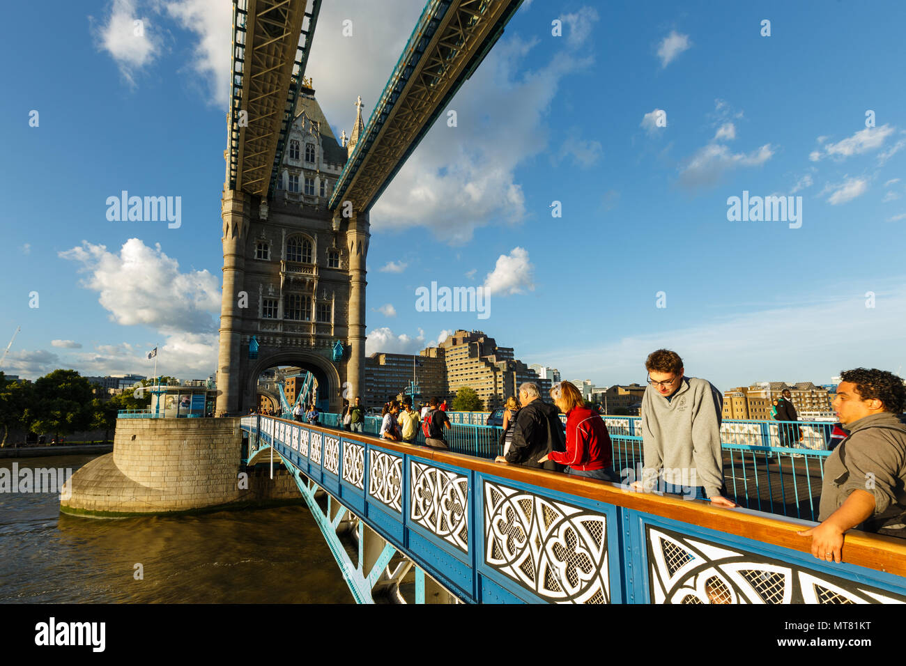 people admire walking on the Tower Bridge. London, evening Stock Photo ...