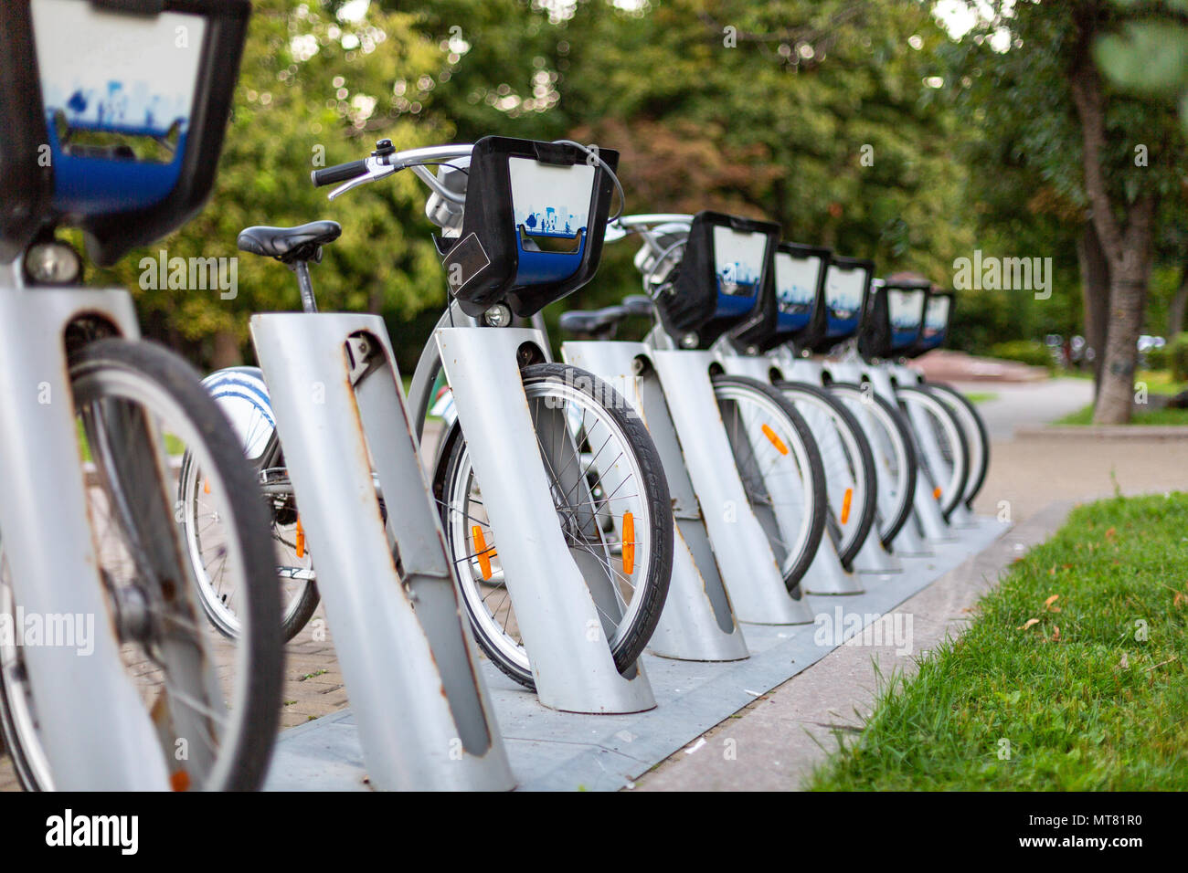 Bicycle rental station on city street Stock Photo - Alamy