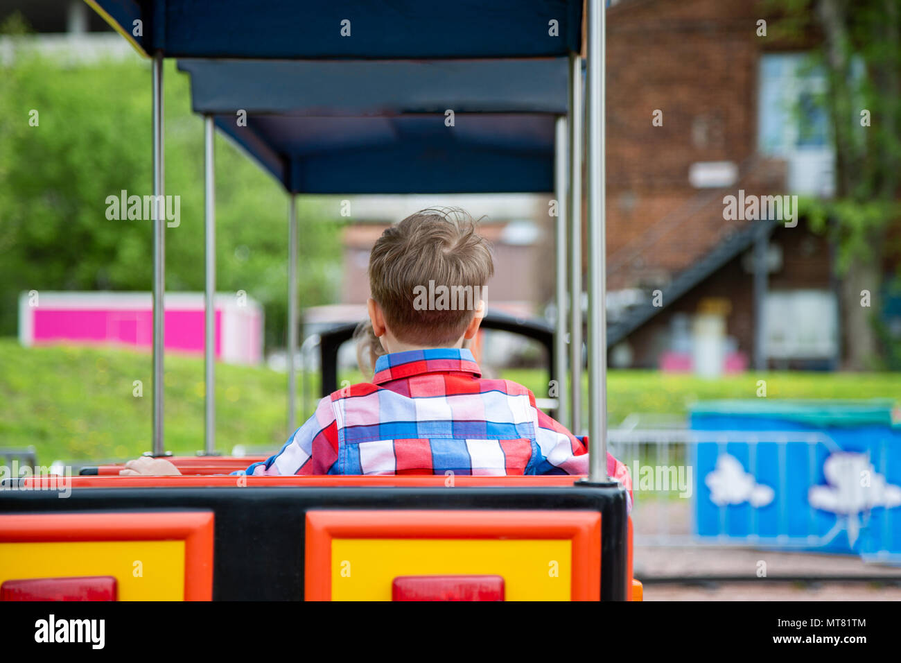 Happy child boy having fun in park. Taking a ride on baby train Stock ...