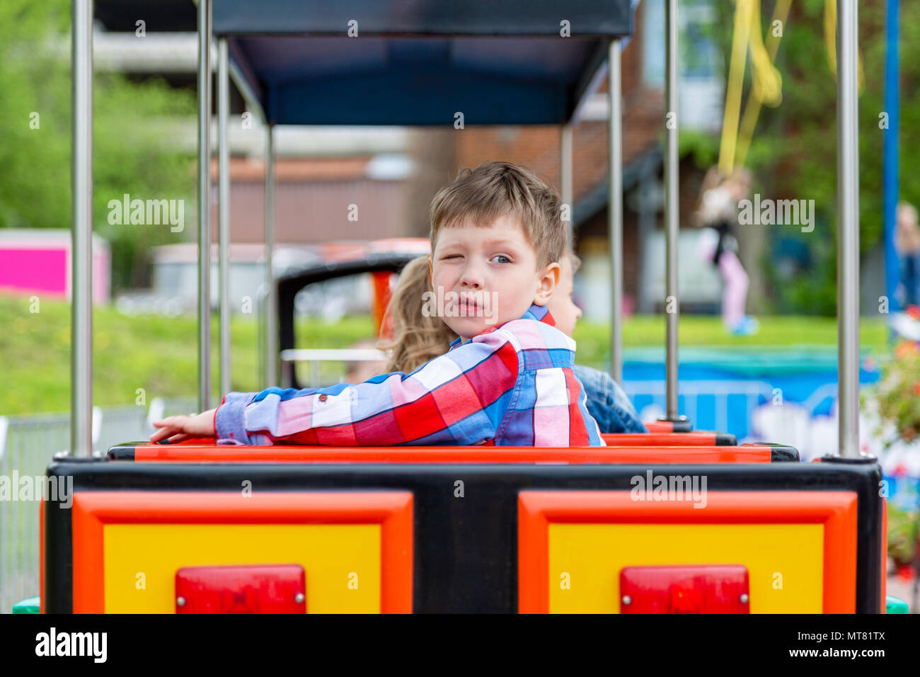 Happy child boy having fun in park. Taking a ride on baby train Stock ...