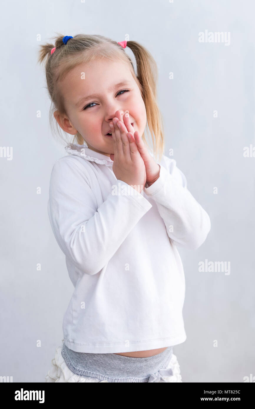 Child folded his hands at the chin Stock Photo - Alamy