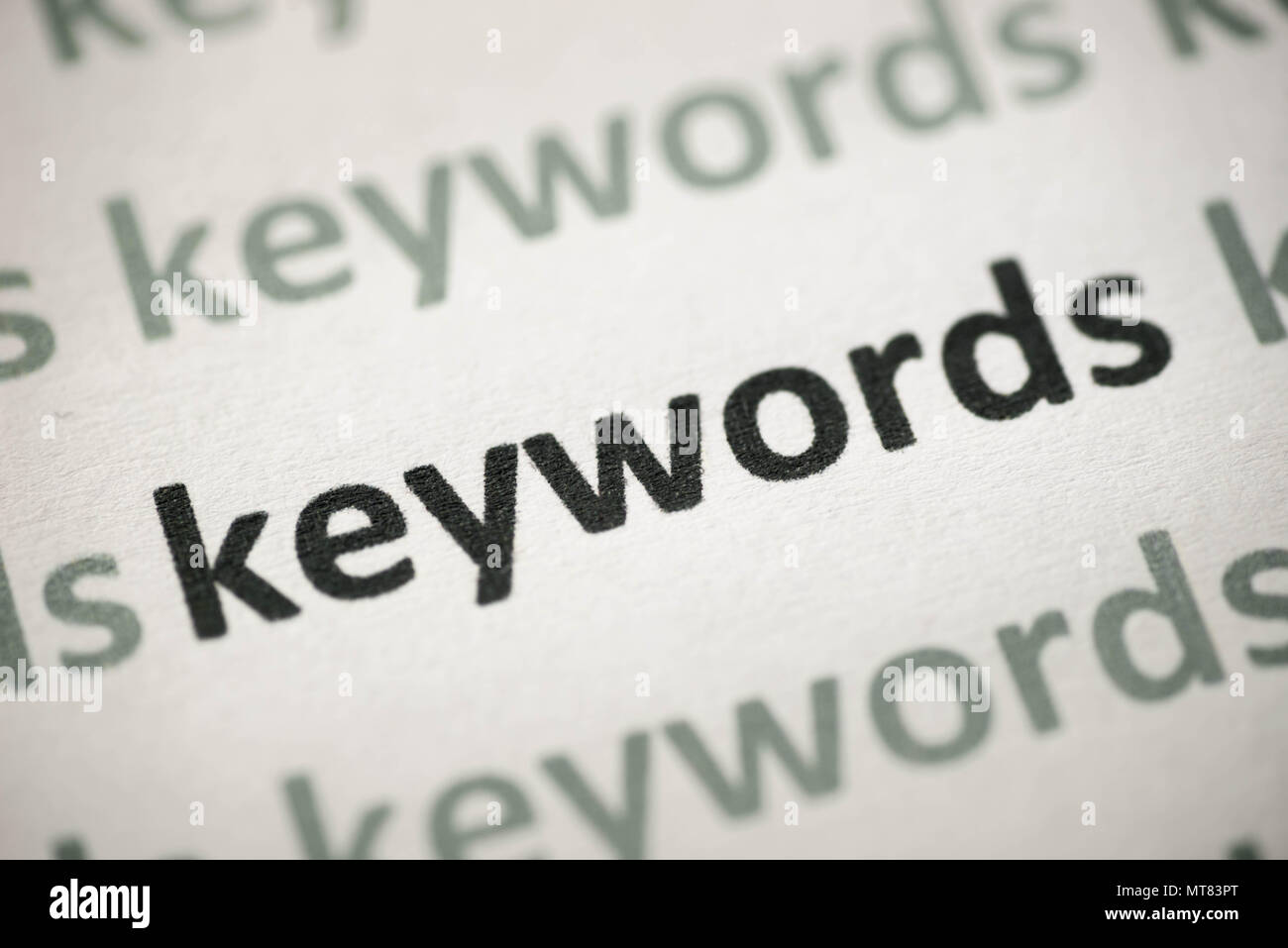 word keywords printed on white paper macro Stock Photo - Alamy