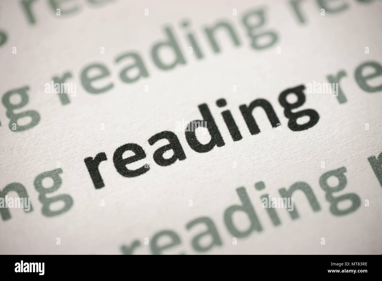 word reading printed on white paper macro Stock Photo - Alamy