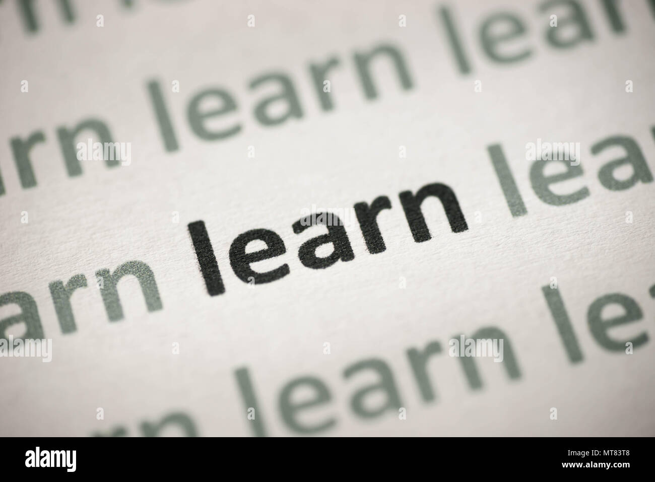 word learn printed on white paper macro Stock Photo - Alamy