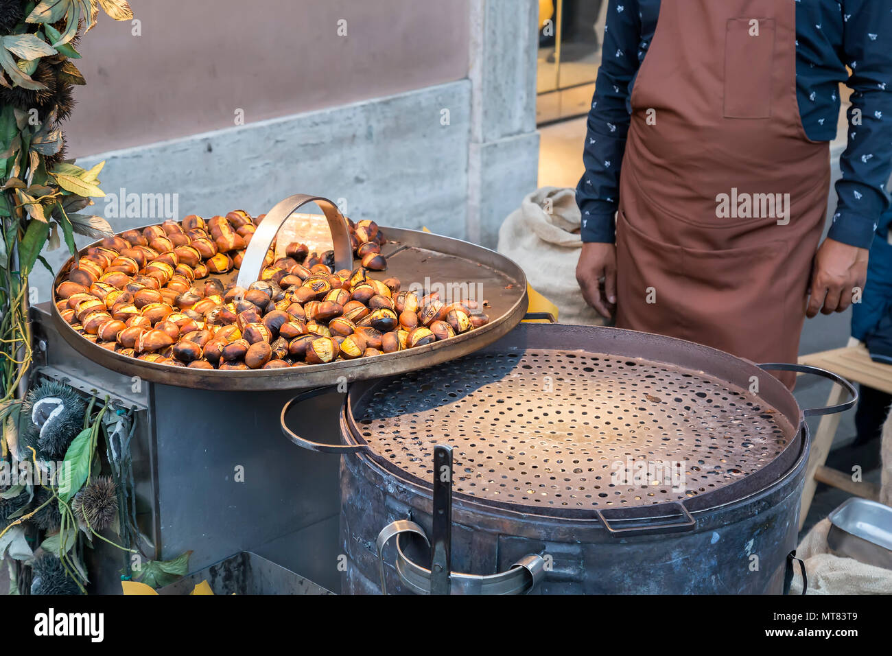 Man Roasting Chestnuts High Resolution Stock Photography and Images - Alamy