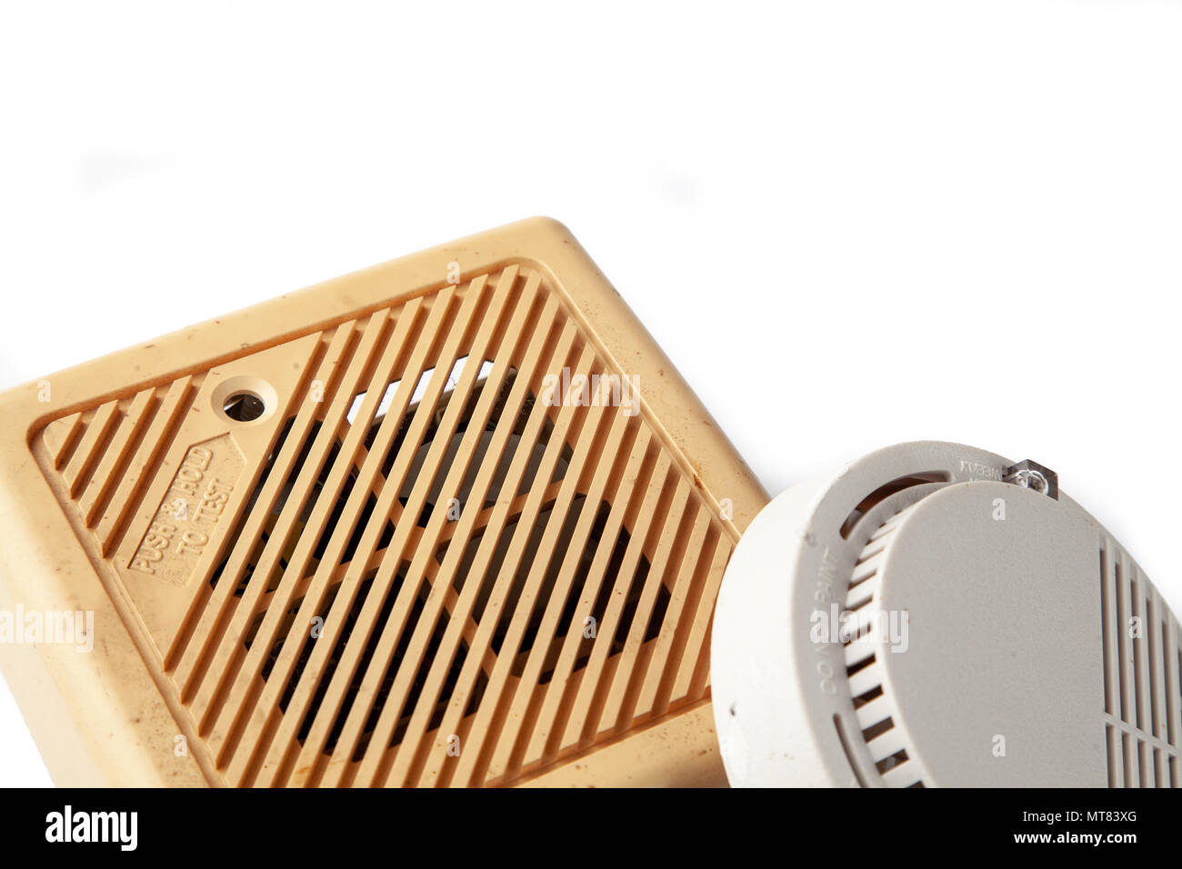 Old domestic smoke detector alarms on white background Stock Photo - Alamy