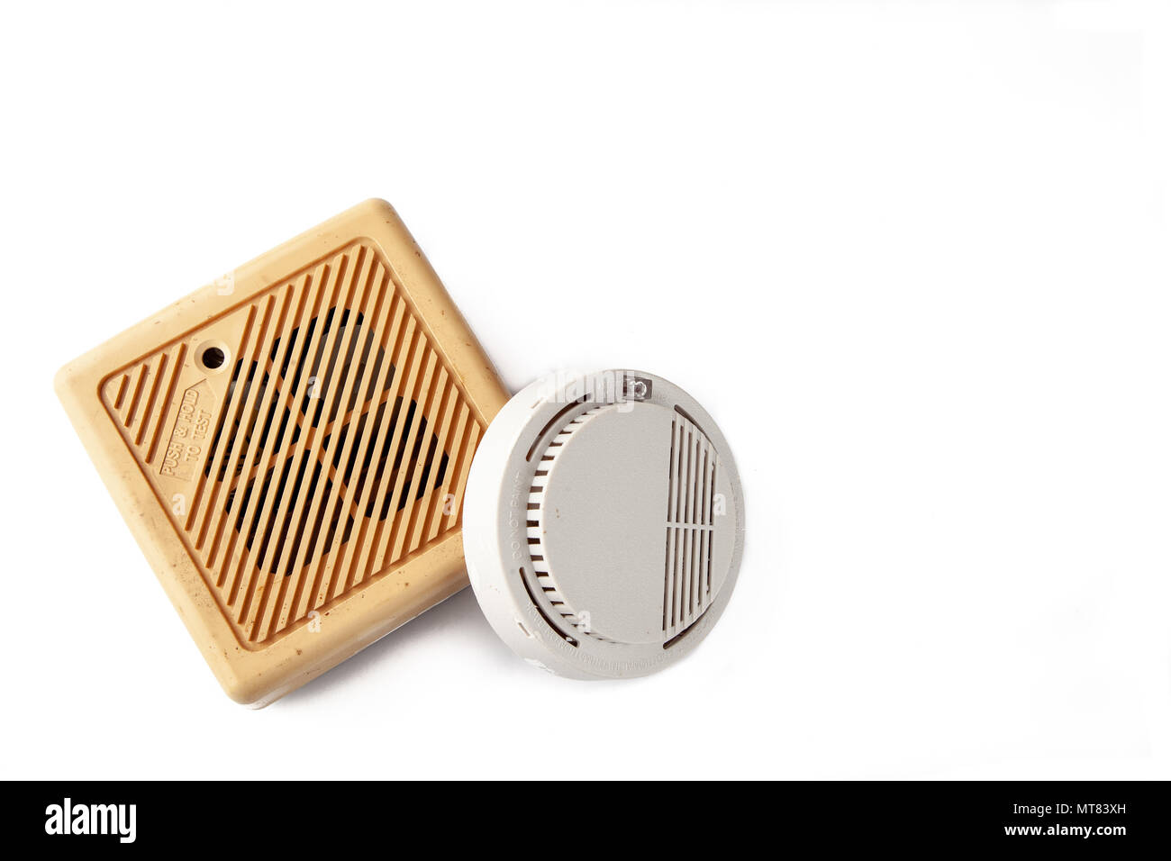 Old domestic smoke detector alarms on white background Stock Photo - Alamy