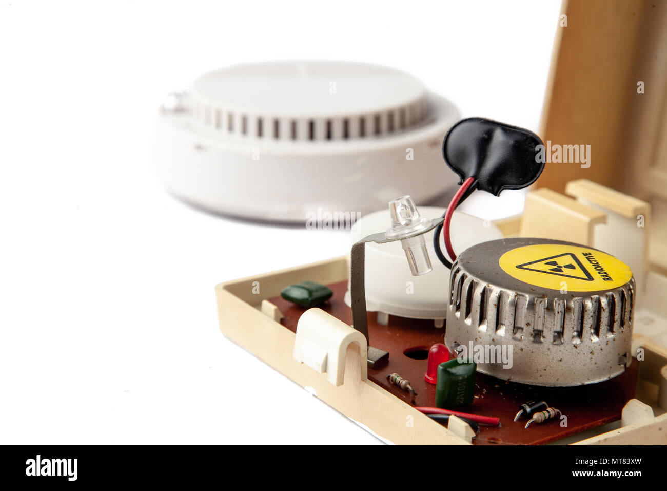 Old domestic smoke detector alarms on white background Stock Photo - Alamy