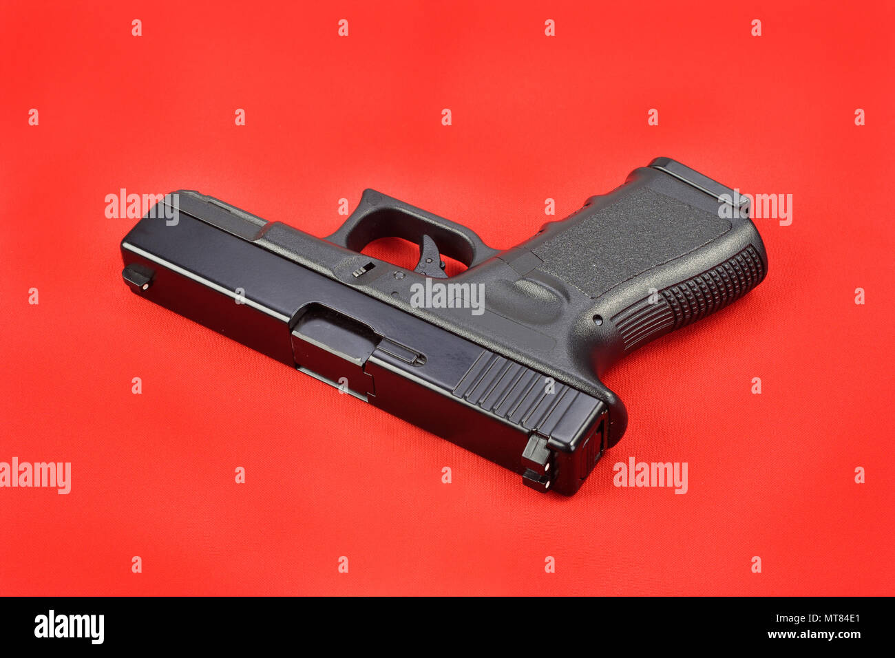 weapon on red background Stock Photo - Alamy