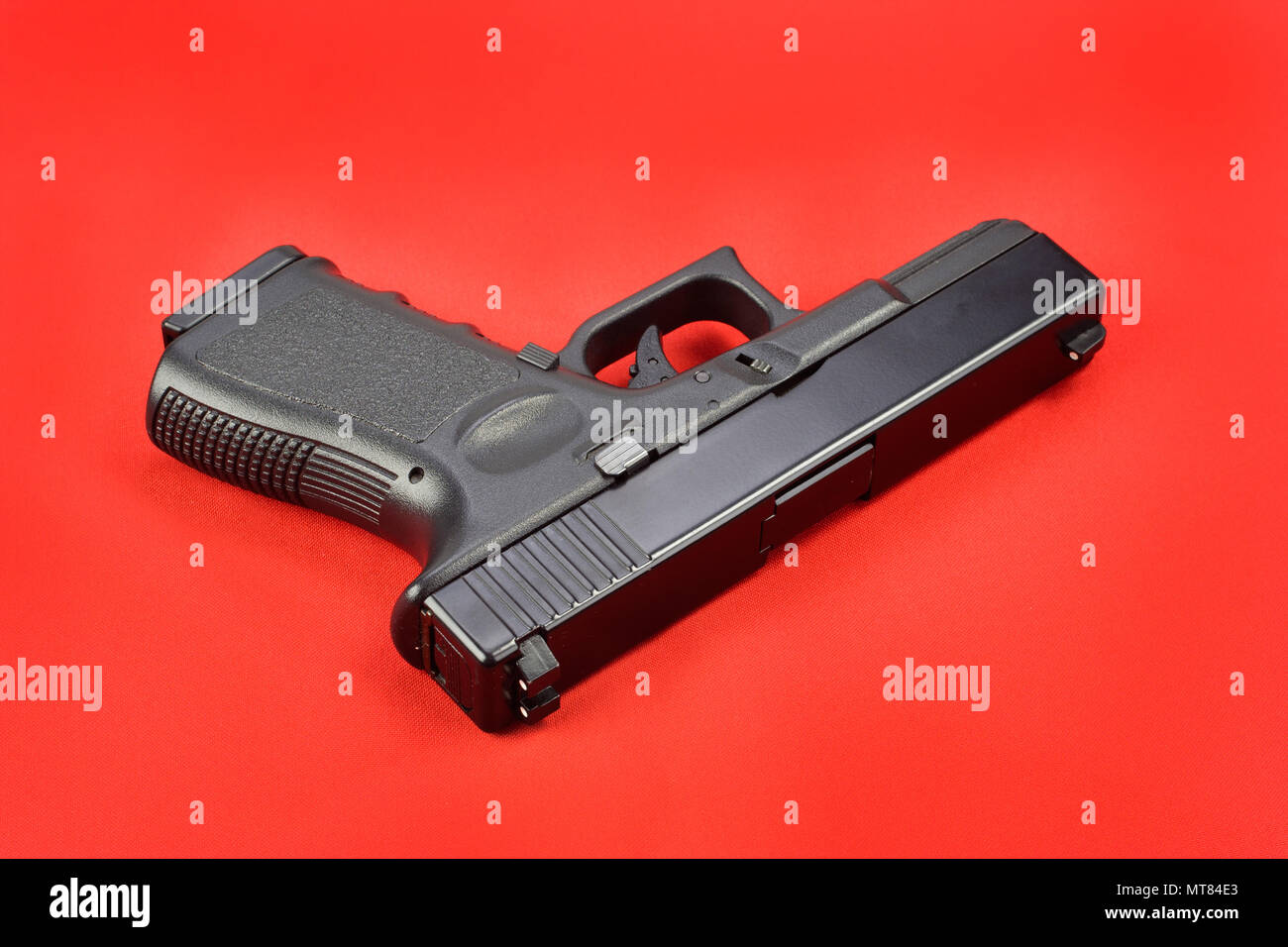 weapon on red background Stock Photo - Alamy