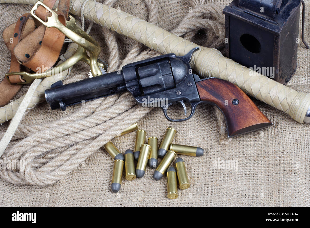 The .45 caliber revolver with western accessories Stock Photo - Alamy