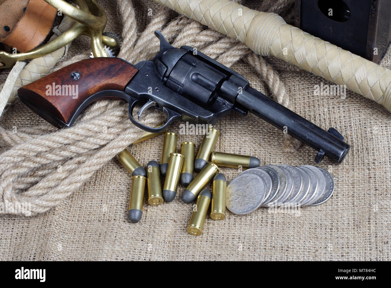 The .45 caliber revolver with western accessories Stock Photo - Alamy