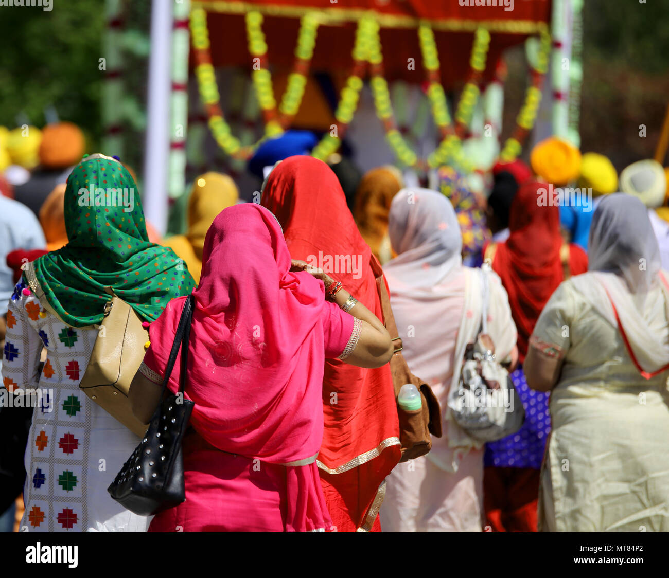 many sikh women with colored dress in the street of city Stock Photo ...