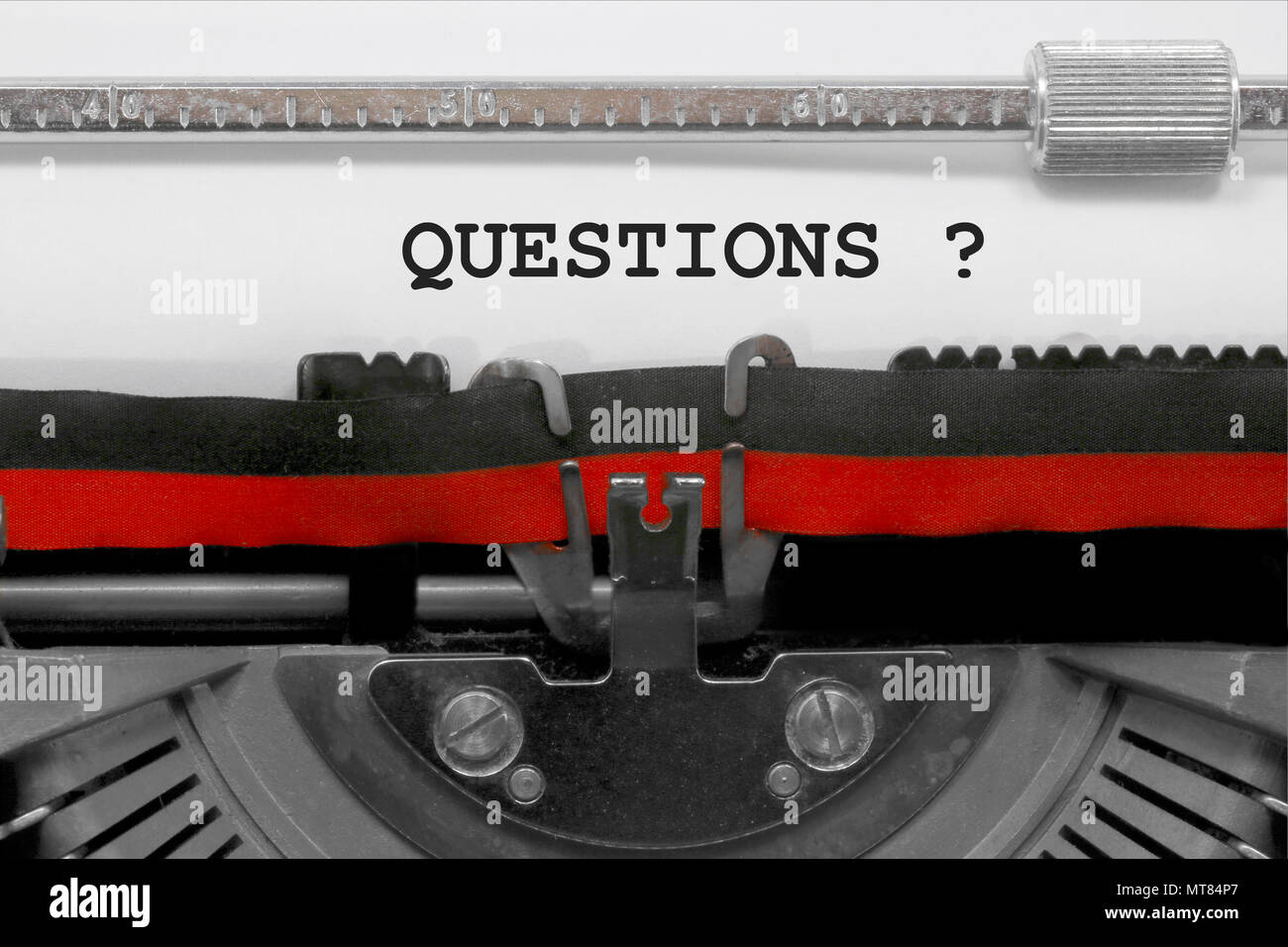 QUESTIONS text written by an old typewriter on white sheet Stock Photo ...