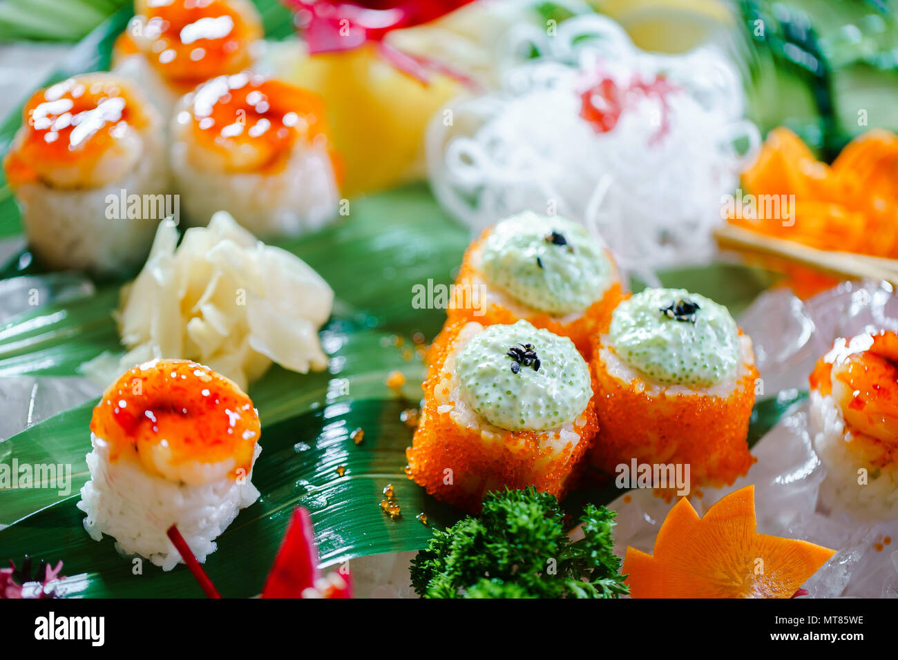 A lot of sushi rolls with different fillings. Shot of cooked classic ...