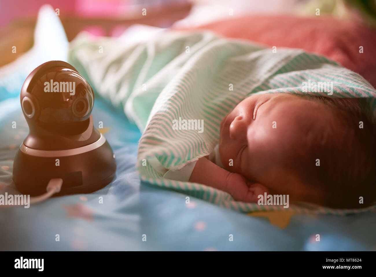 Monitoring sleeping baby with dome camera close-up view Stock Photo - Alamy
