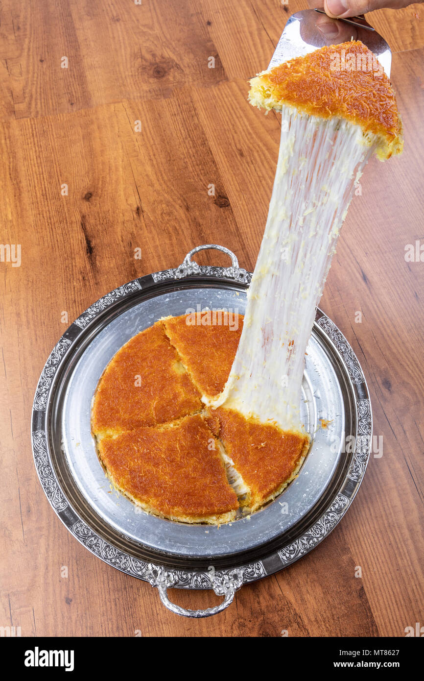 Turkish dessert kunefe, kunafa, kadayif with pistachio powder and ...