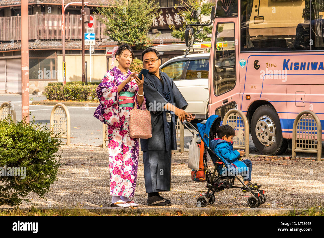 Men and women walking round Kyoto Japan in traditional Japanese Kimono ...