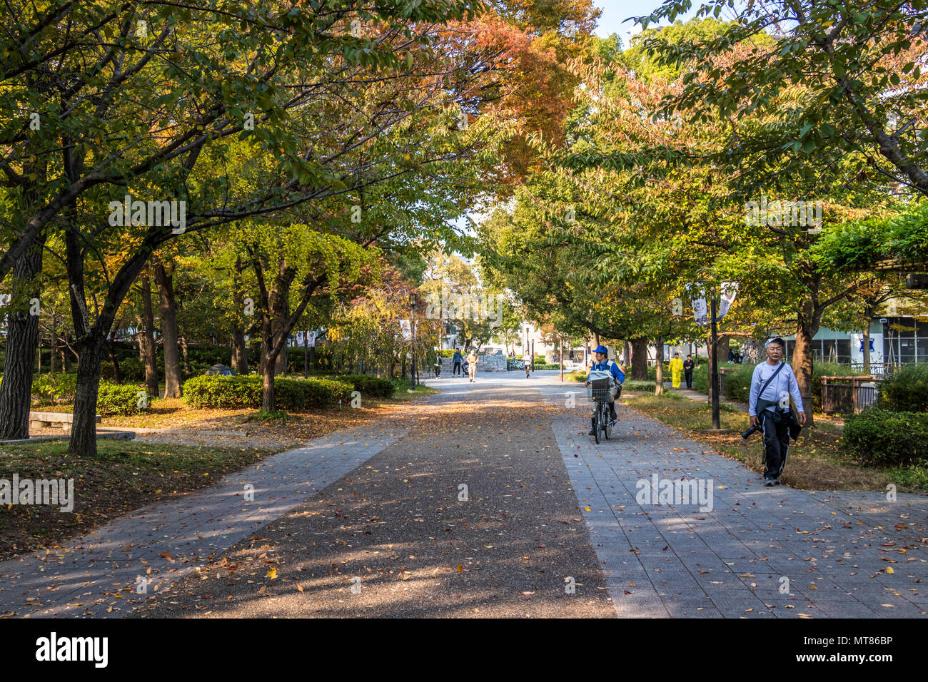 Cycling in Osaka Castle Park Osaka Japan Stock Photo - Alamy