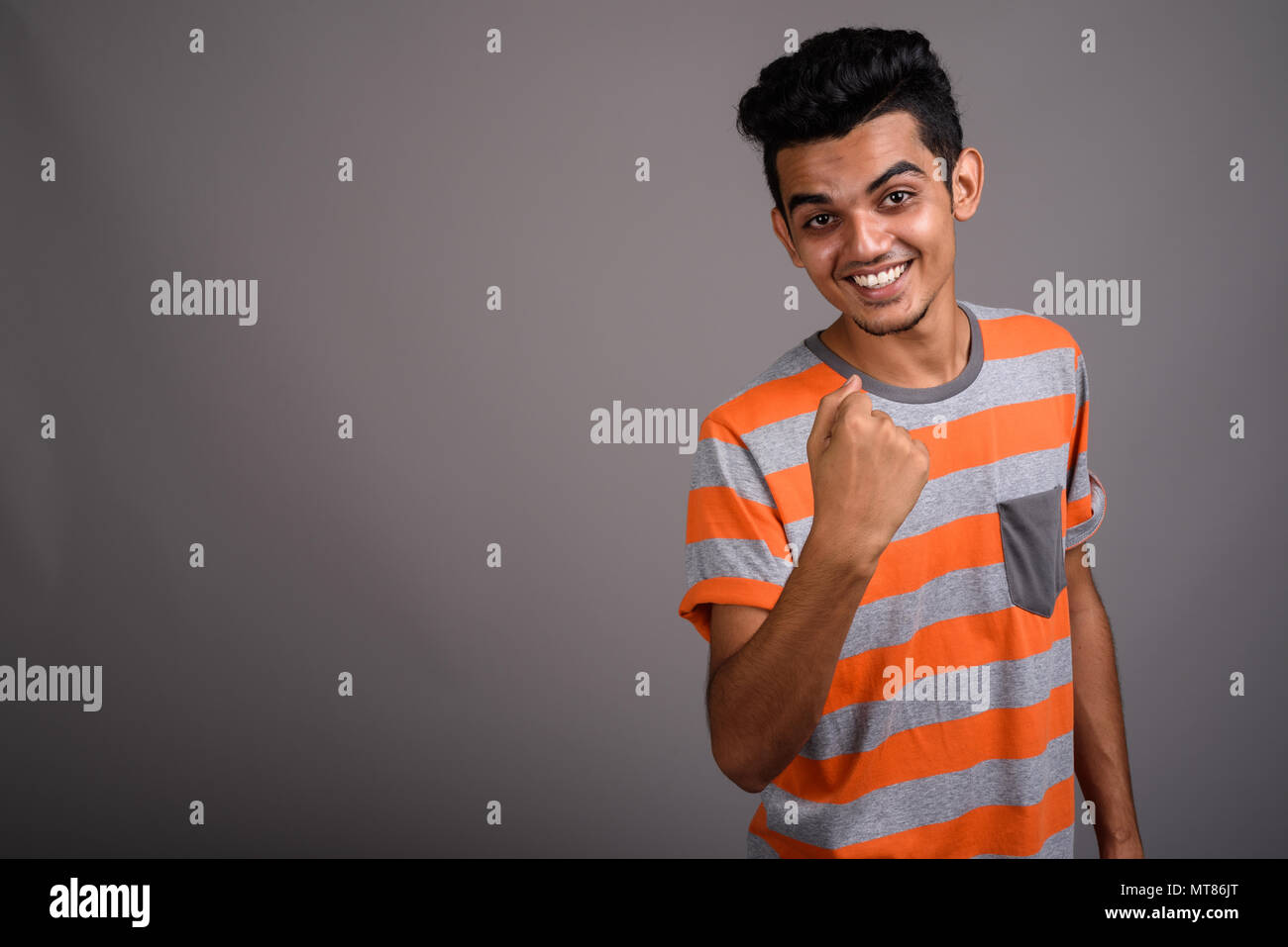 Young excited indian man hi-res stock photography and images - Alamy