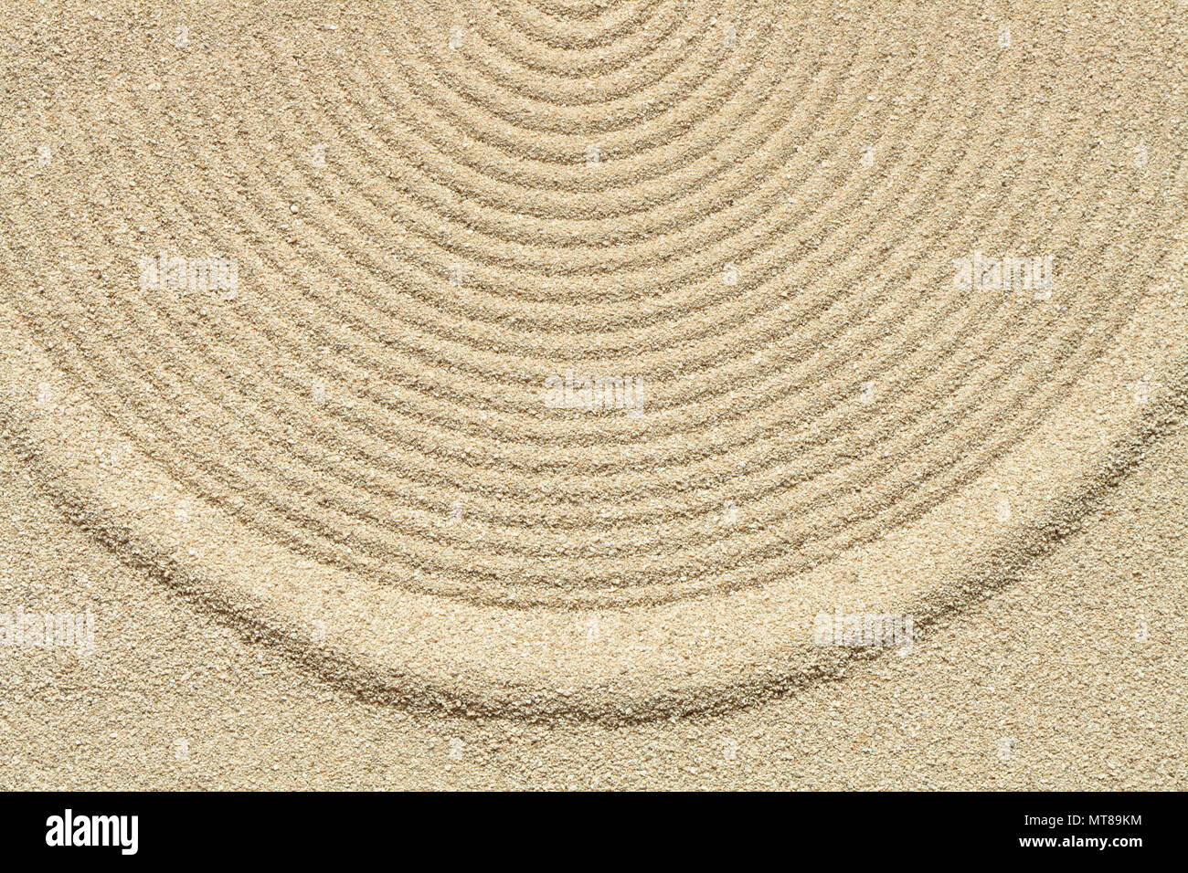 Abstract yellow sand background with drawing rings Stock Photo - Alamy
