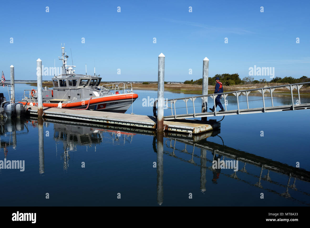 A crew member from Coast Guard Station Emerald Isle, North Carolina ...