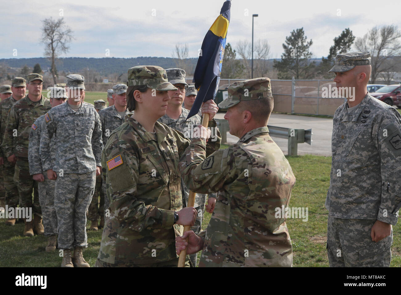 U.S. Army Capt. Jolene Kayser, left, receives the guidon of the 881st ...