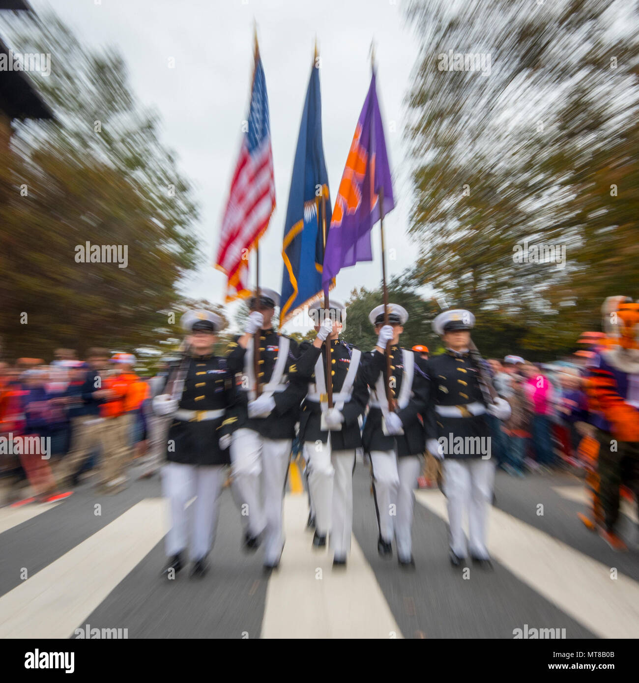 The Clemson University Pershing Rifles honor guard lead the parade into ...