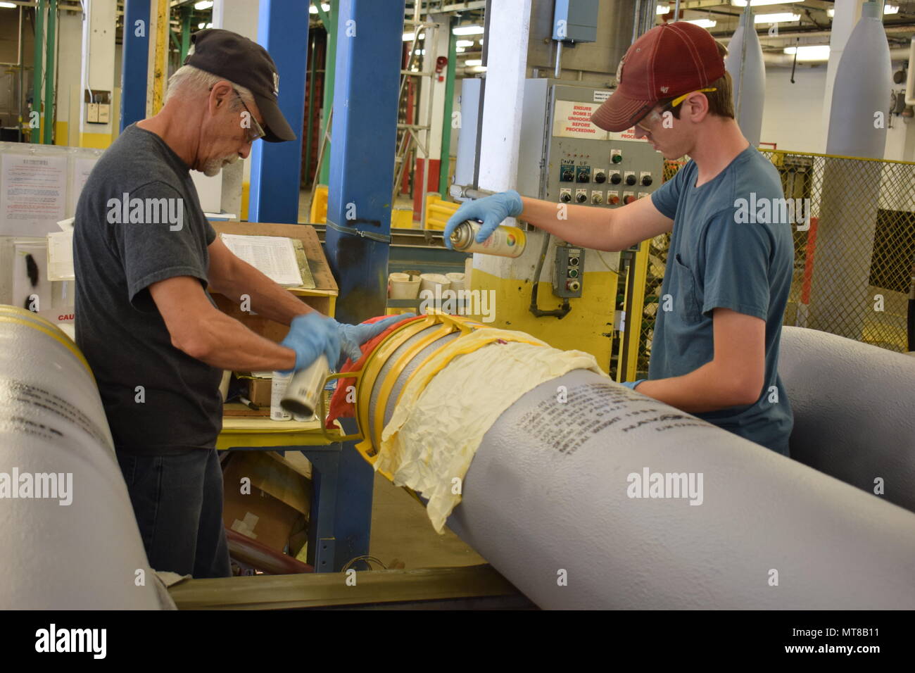 Employees at Crane Army Ammunition Activity put the finishing touches ...