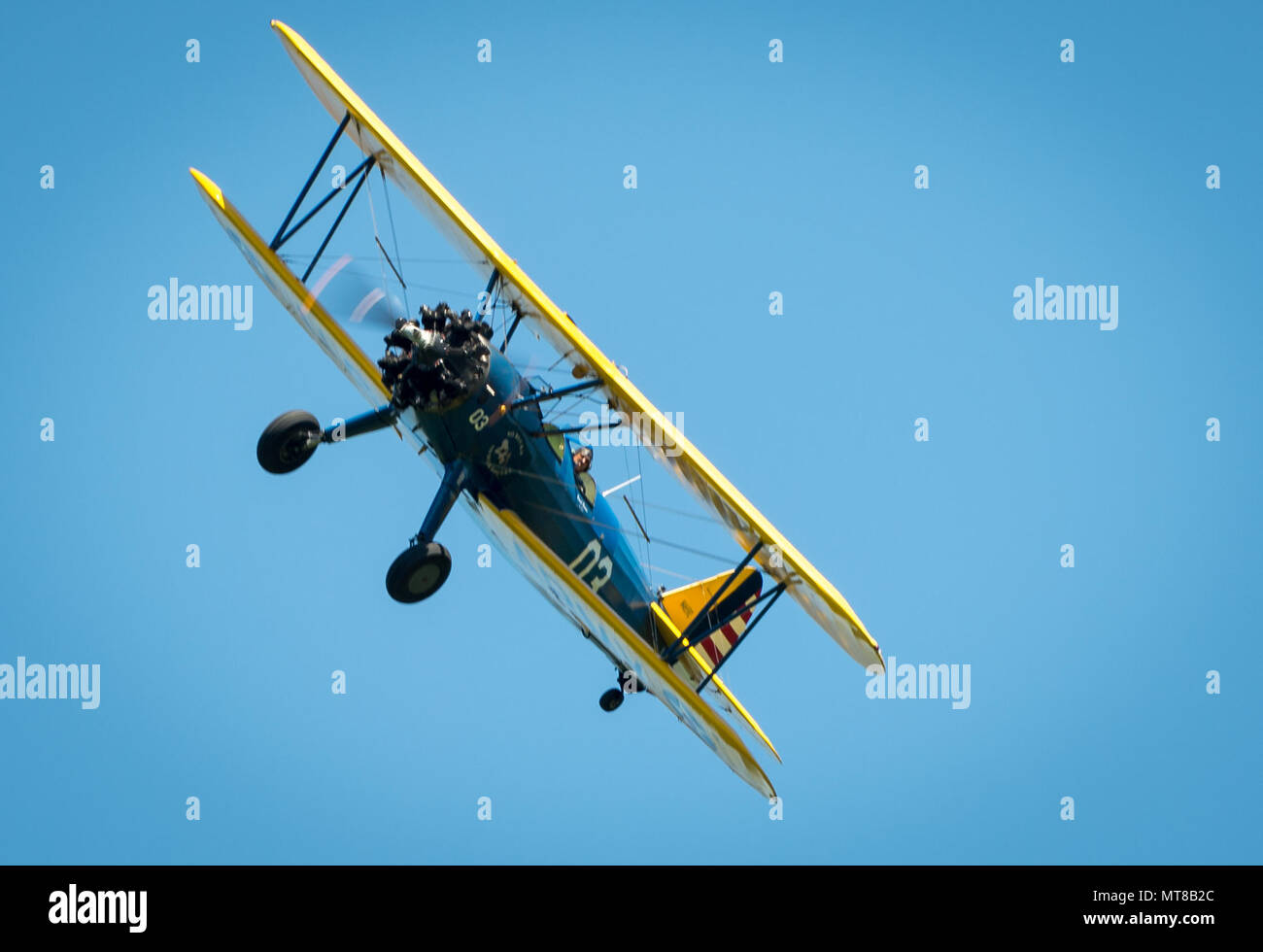 David Brown makes a low pass over the field in his PT-17 Stearman ...