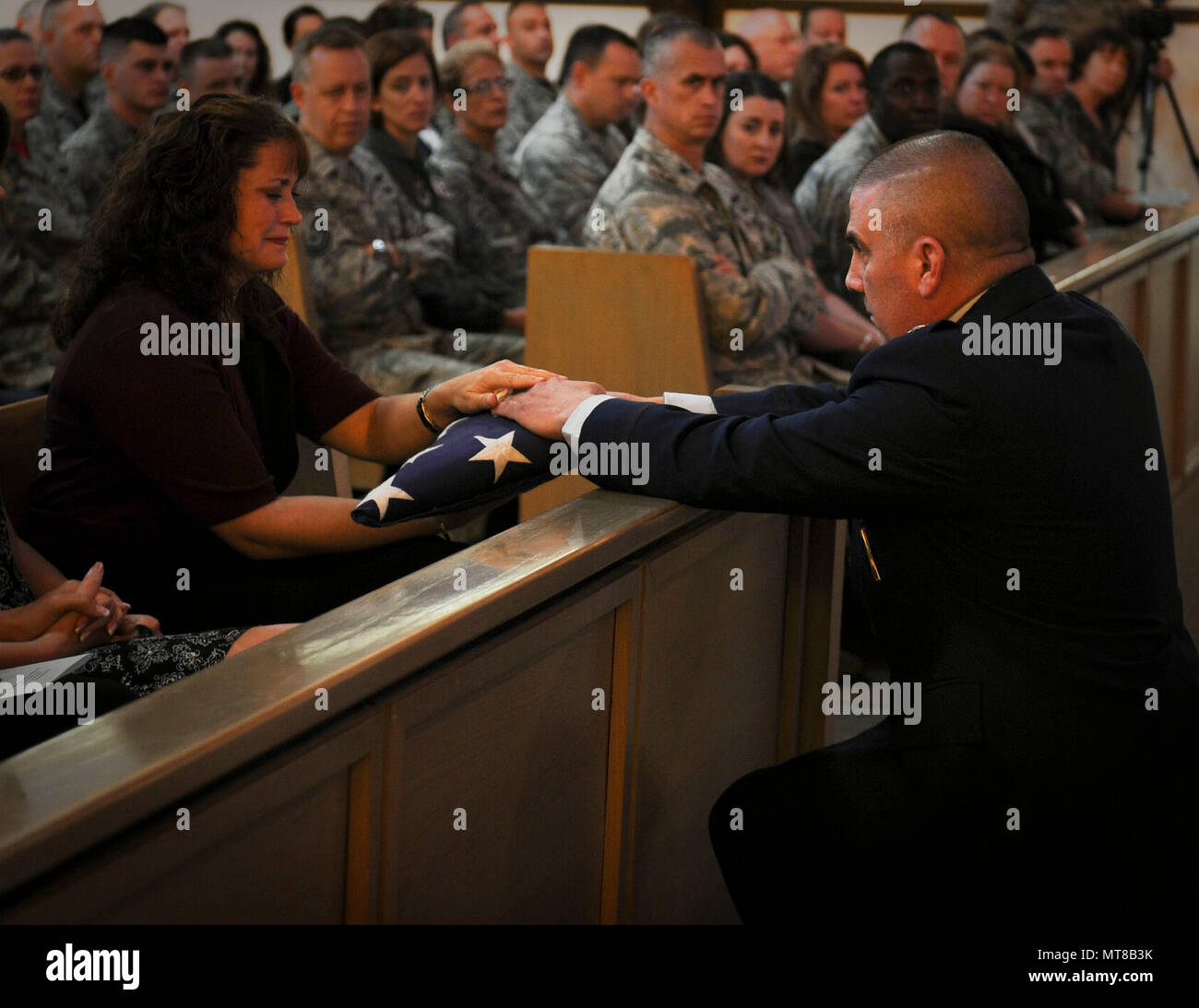 Amy Leach receives a flag from Lt. Col. Louis Rognoni, 91st Missile ...