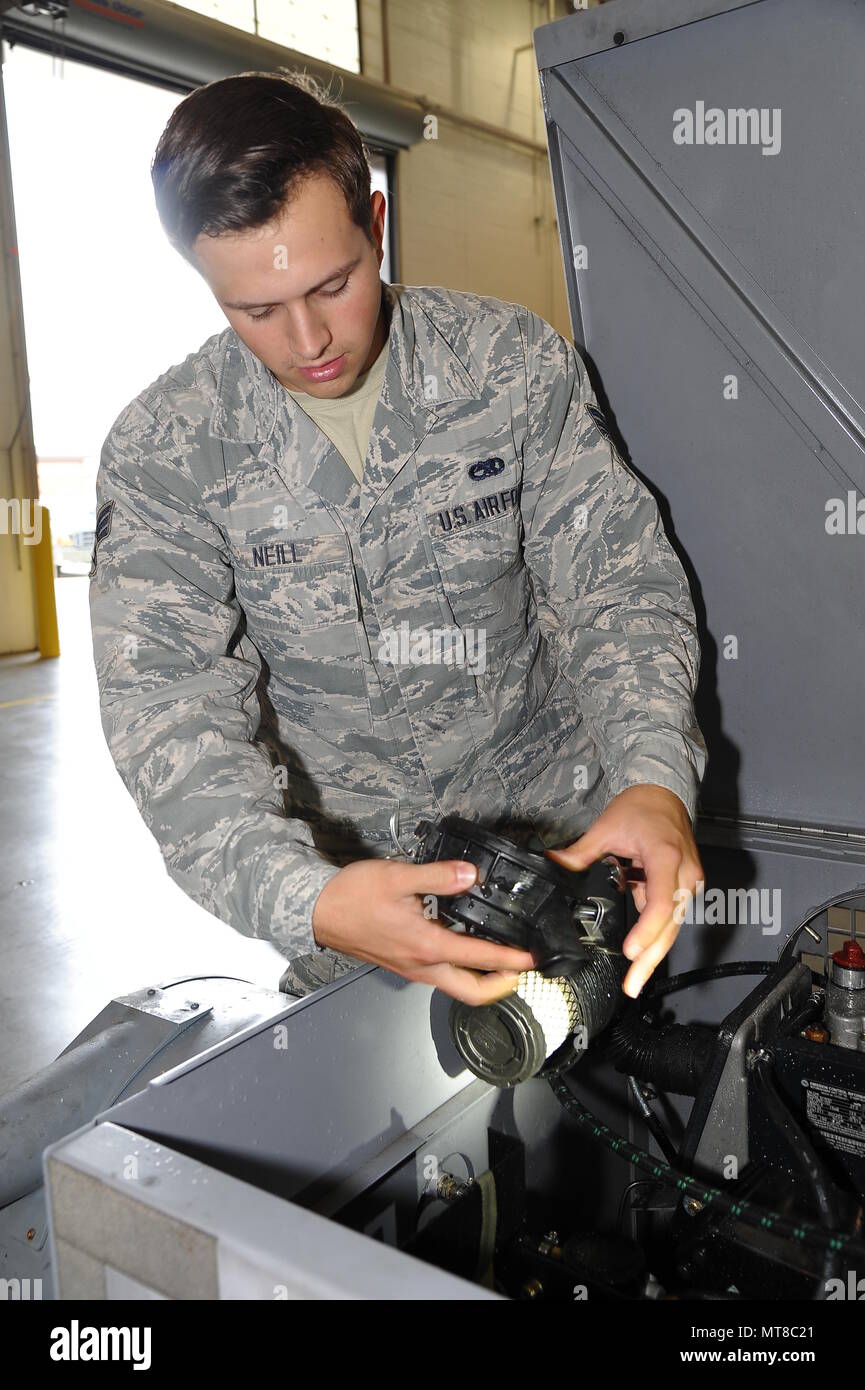 Senior Airman Matt Neill conducts an annual inspection of an MC-20 Air ...