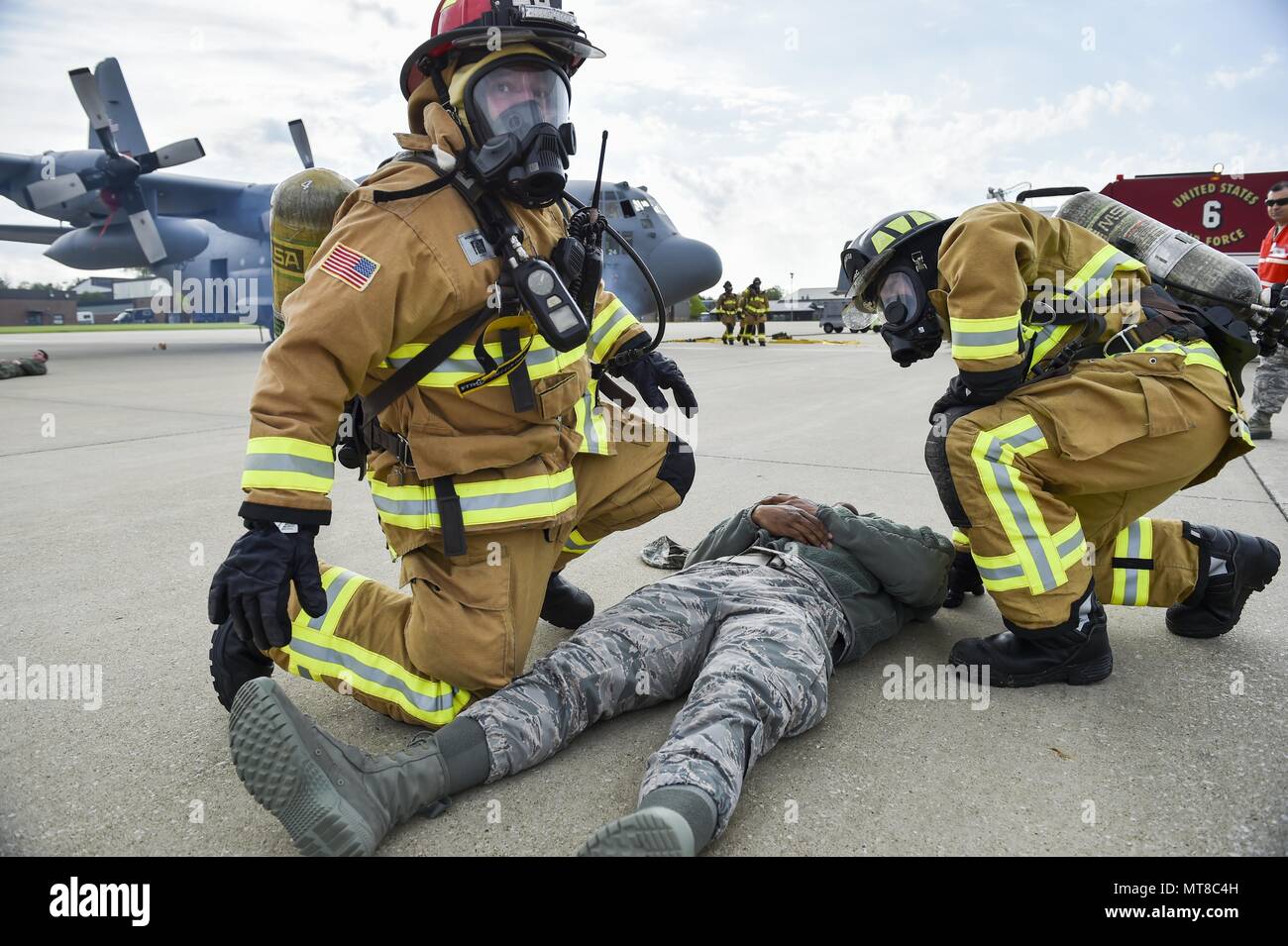 Kevin Brichetto and Staff Sgt. Scott Carey, both firefighters with the ...