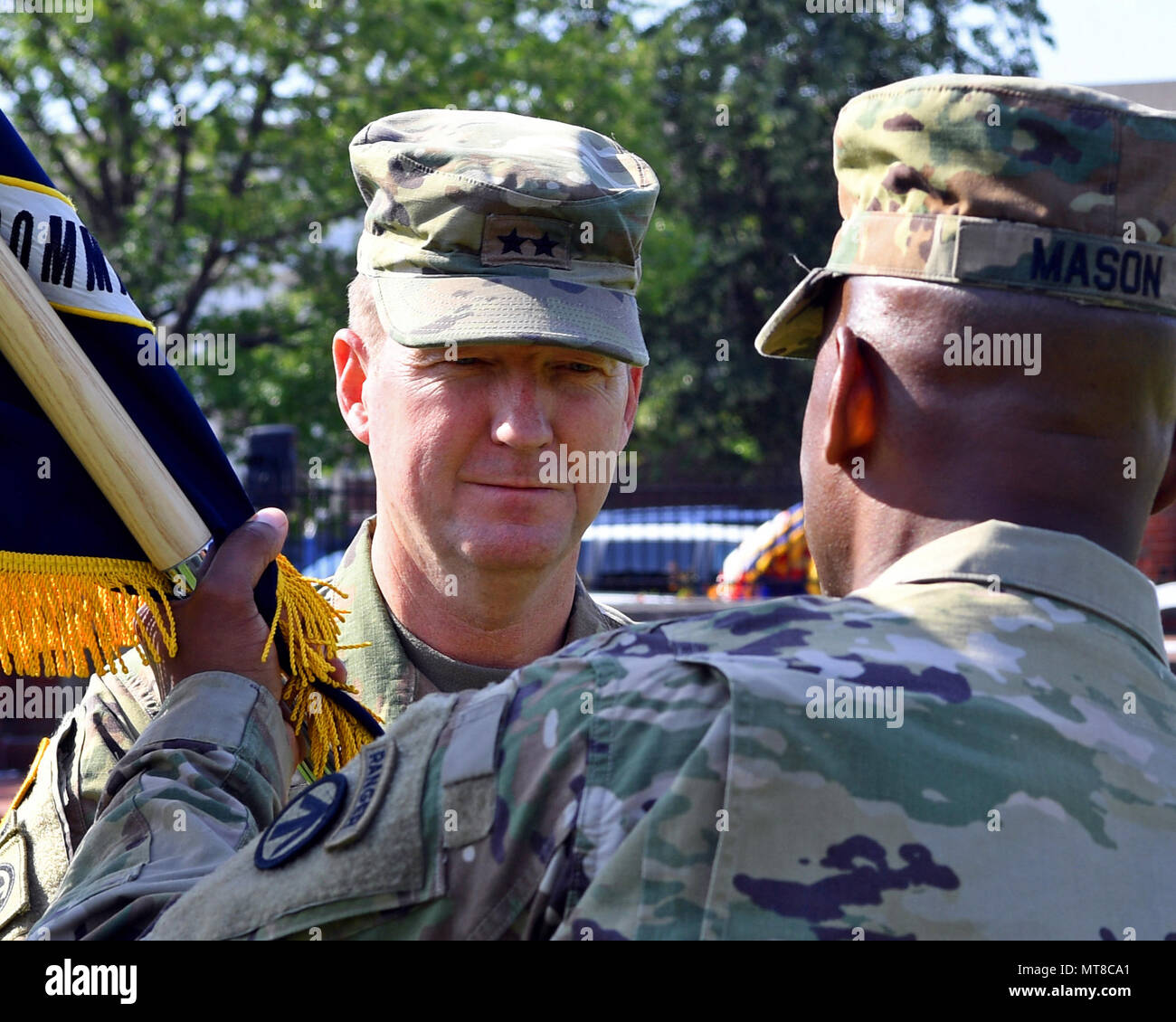 SDDC Commanding General Maj. Gen. Kurt J. Ryan (left) passes the colors ...