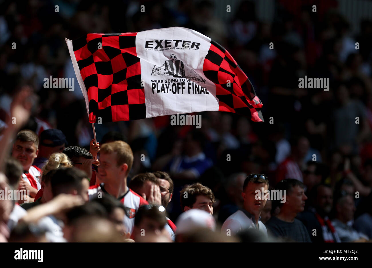 An Exeter City flag is waved by fans before the Sky Bet League Two ...