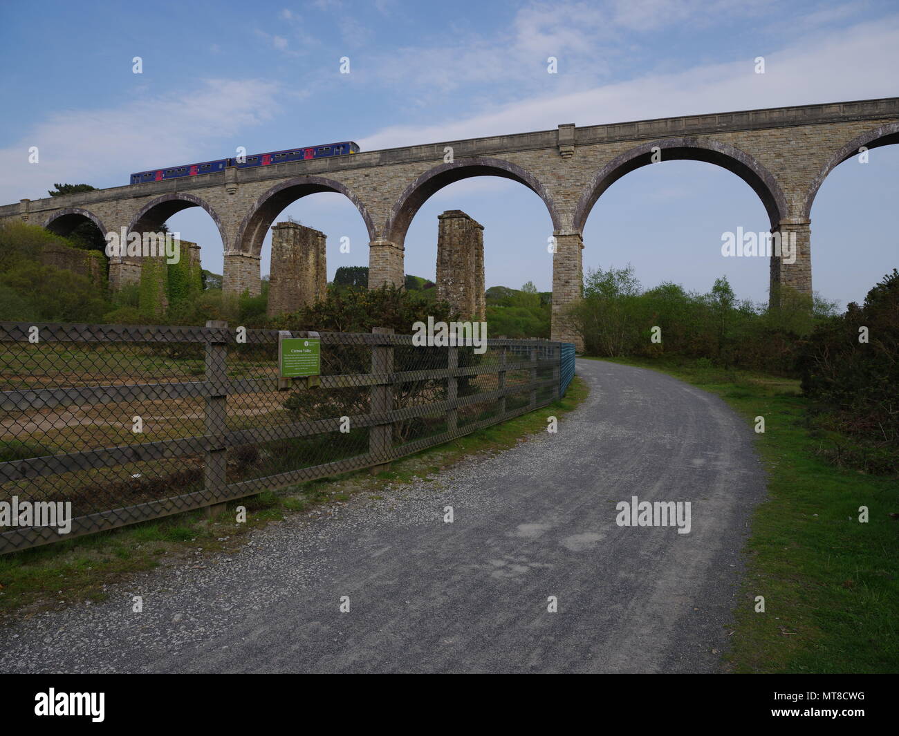 South West train crossing the Brunel bridge, Carnon Valley, Cornwall ...