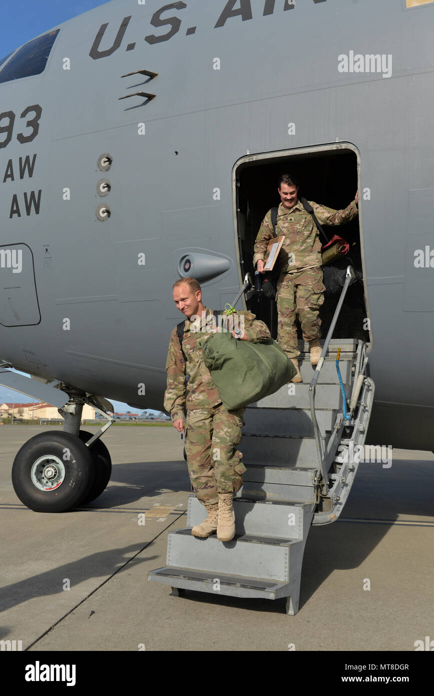 U.S. Air Force Lt. Col. Pat Rayner, 921st Contingency Response Squadron commander, exits a C-17 ...