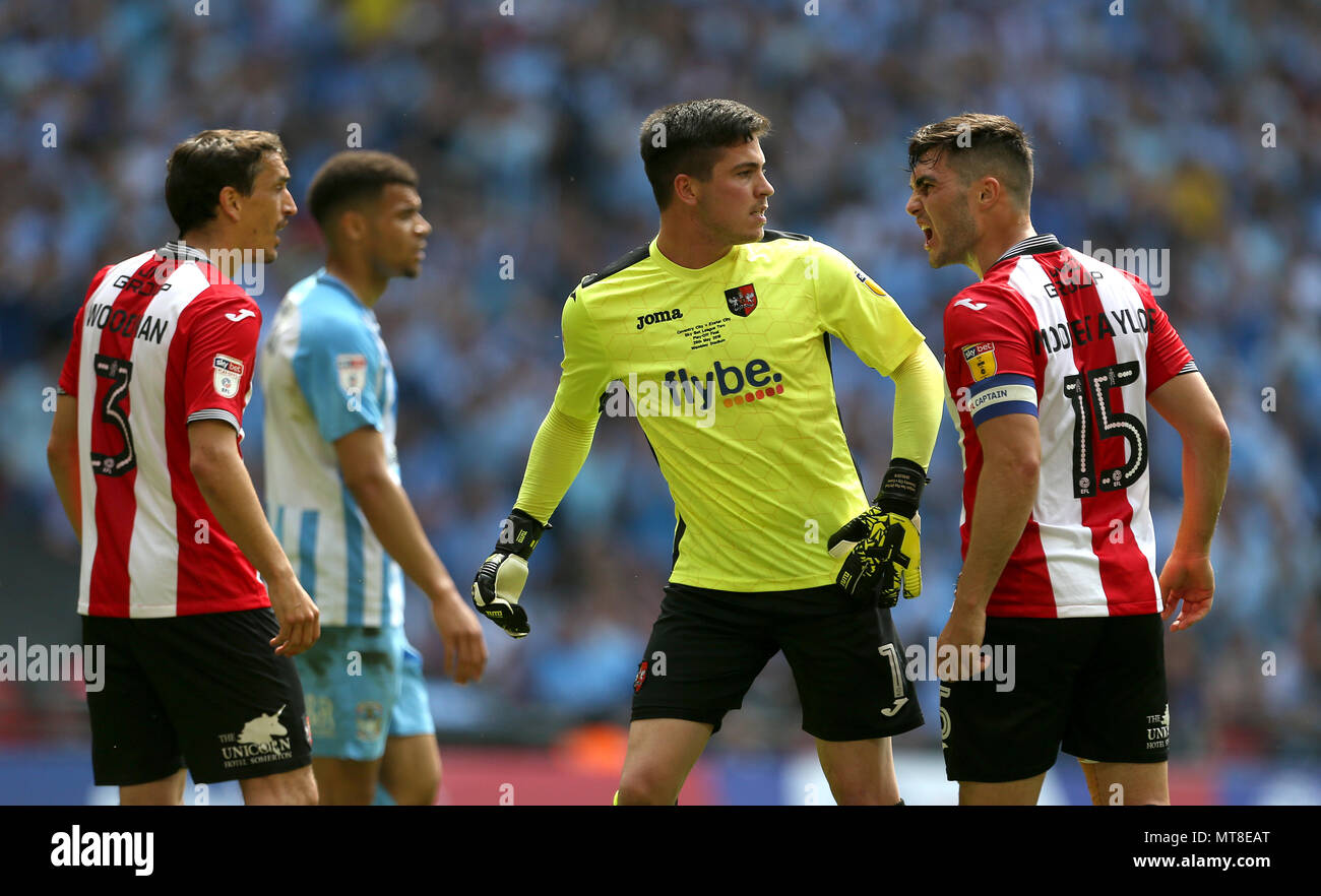Exeter City's goalkeeper Christy Pym is spoken to by team-mate Jordan ...