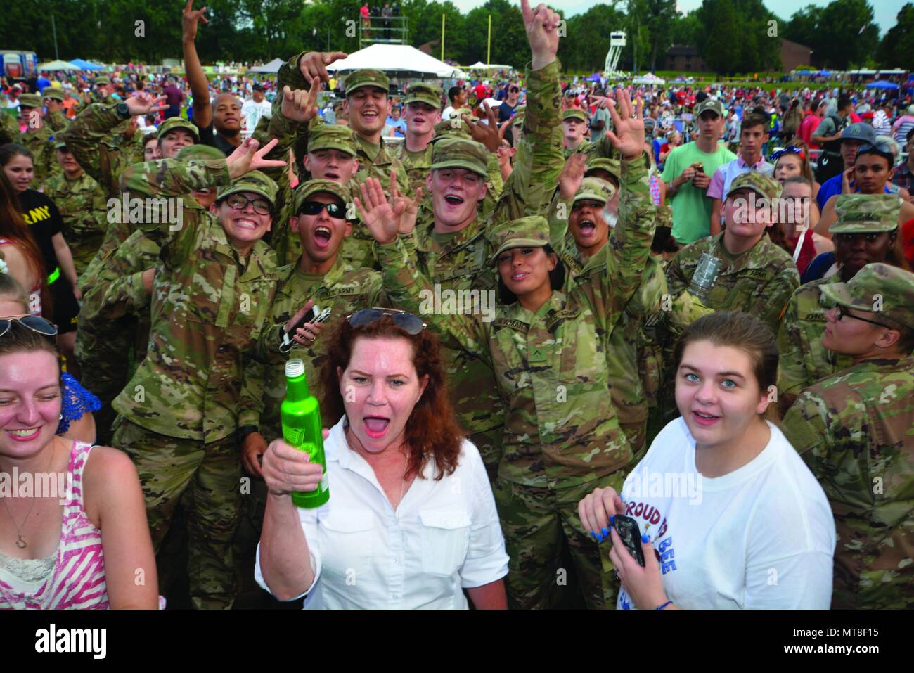 A group of advanced individual training Soldiers show their excitement ...