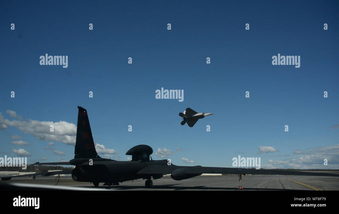 An F-22 Raptor soars by a U-2 Dragon Lady during exercise Northern Edge ...