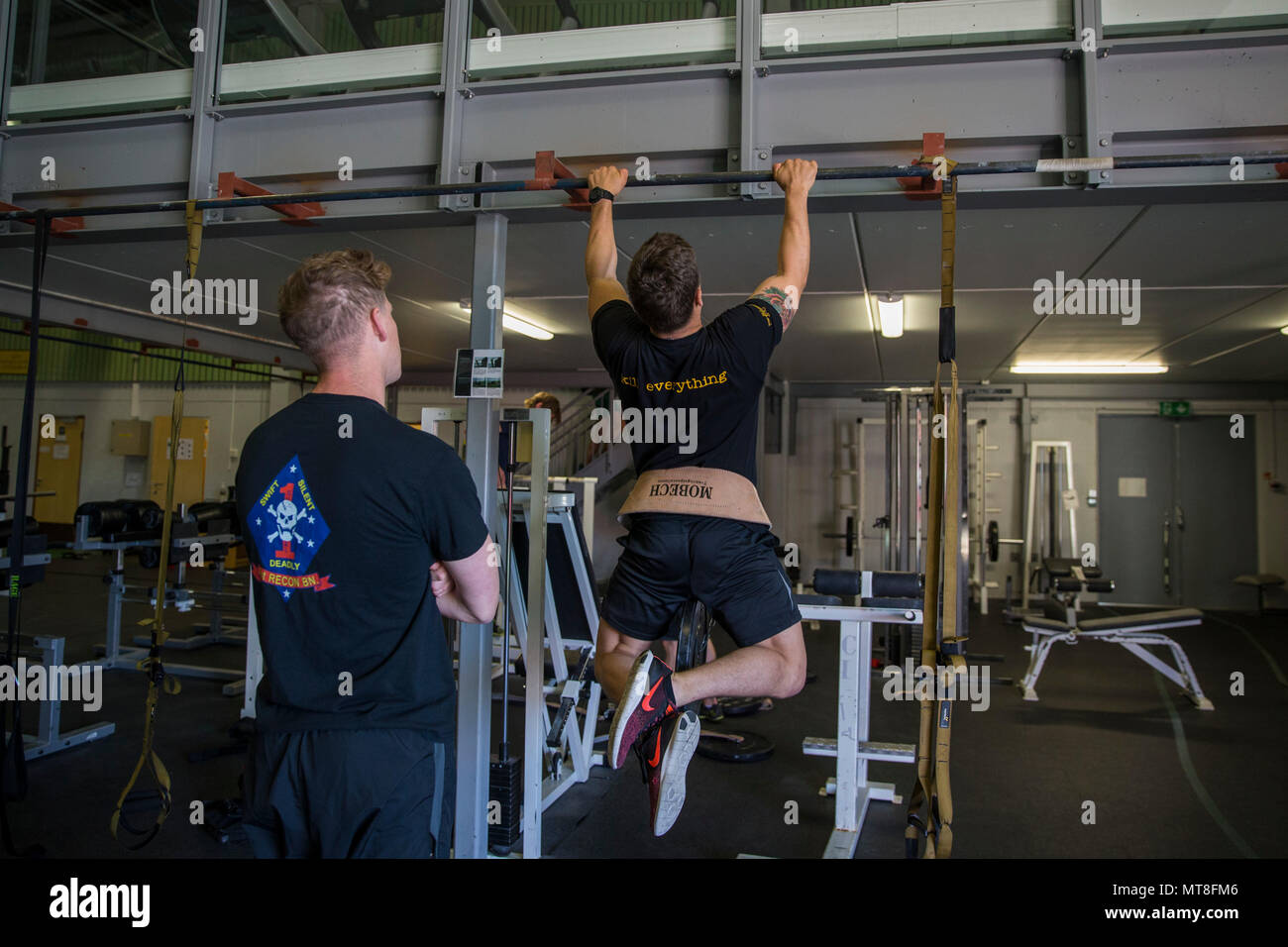 A U.S. Marine with 1st Platoon, 1st Reconnaissance Battalion, 1st Marine Division, performs ...