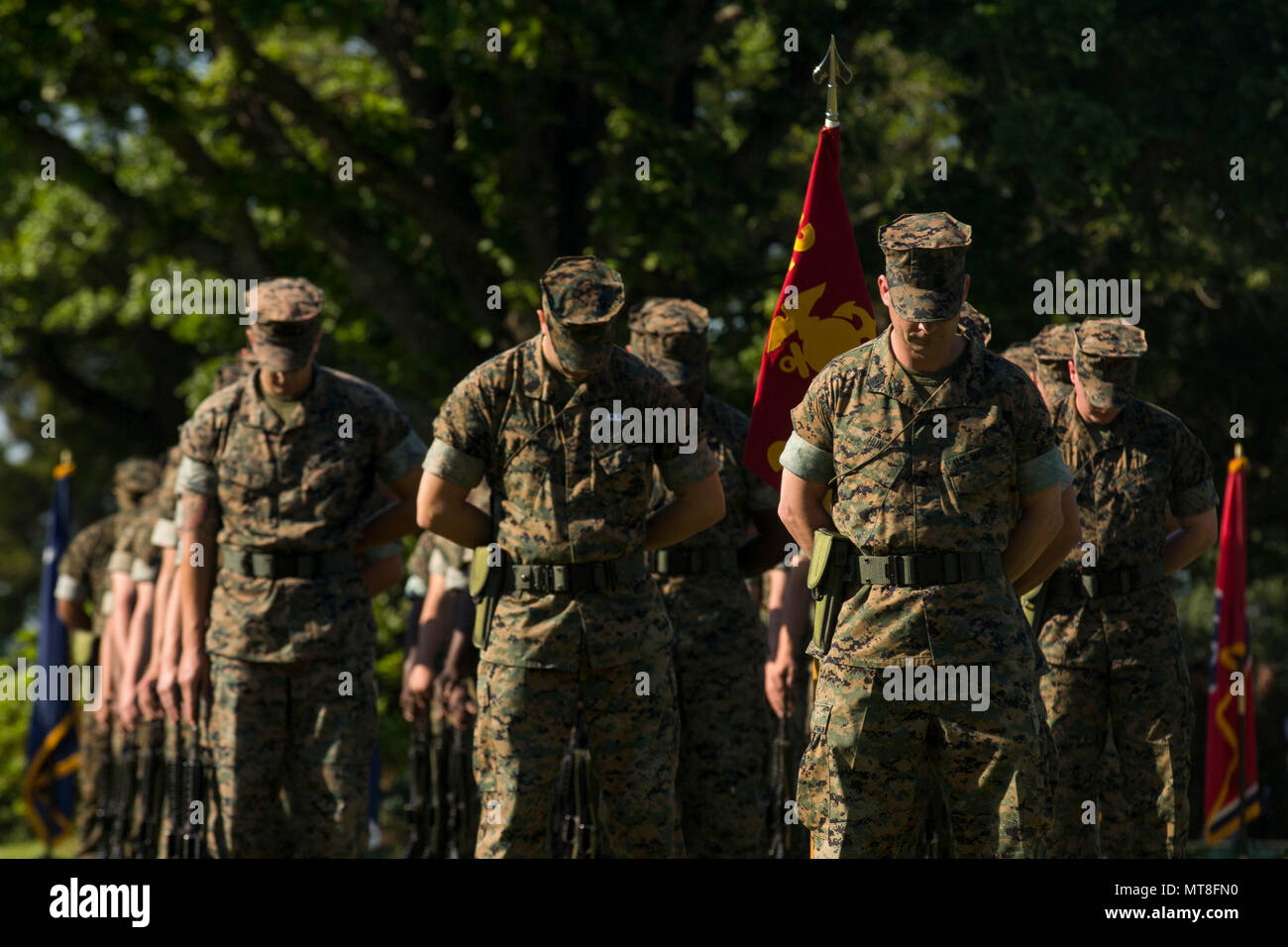 U.S. Marines and Sailors with 2nd Marine Division (2d MARDIV) bow their ...