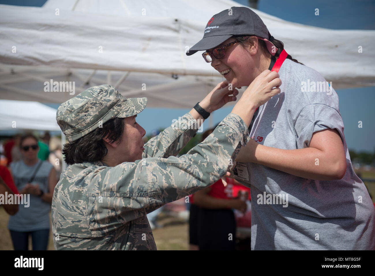 Col. Jeannine Ryder, 81st Medical Group commander, presents Brandy Ashe ...