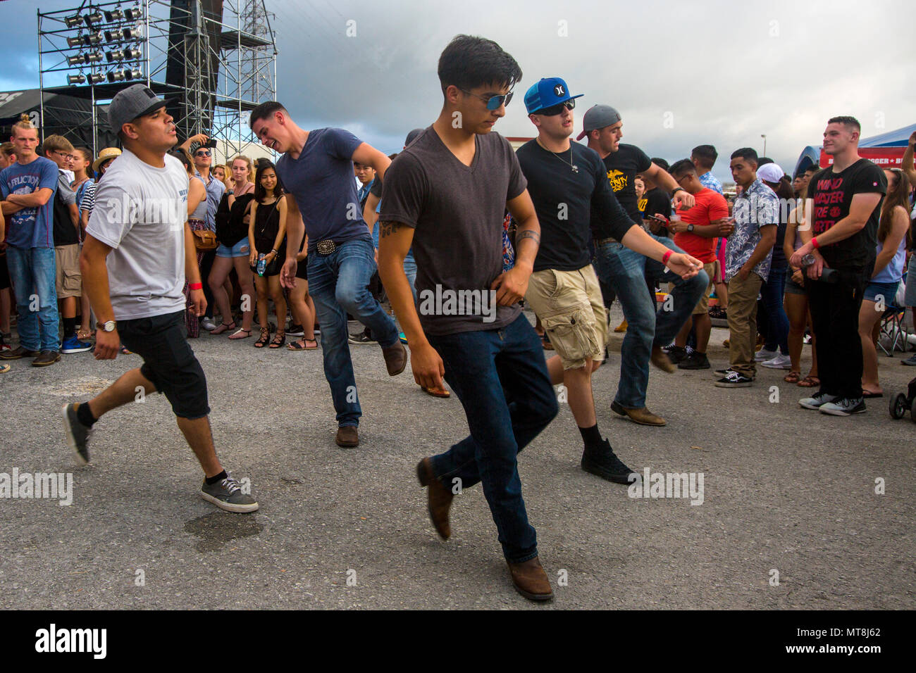 CAMP FOSTER, OKINAWA, Japan – Marines line dance to a local band ...