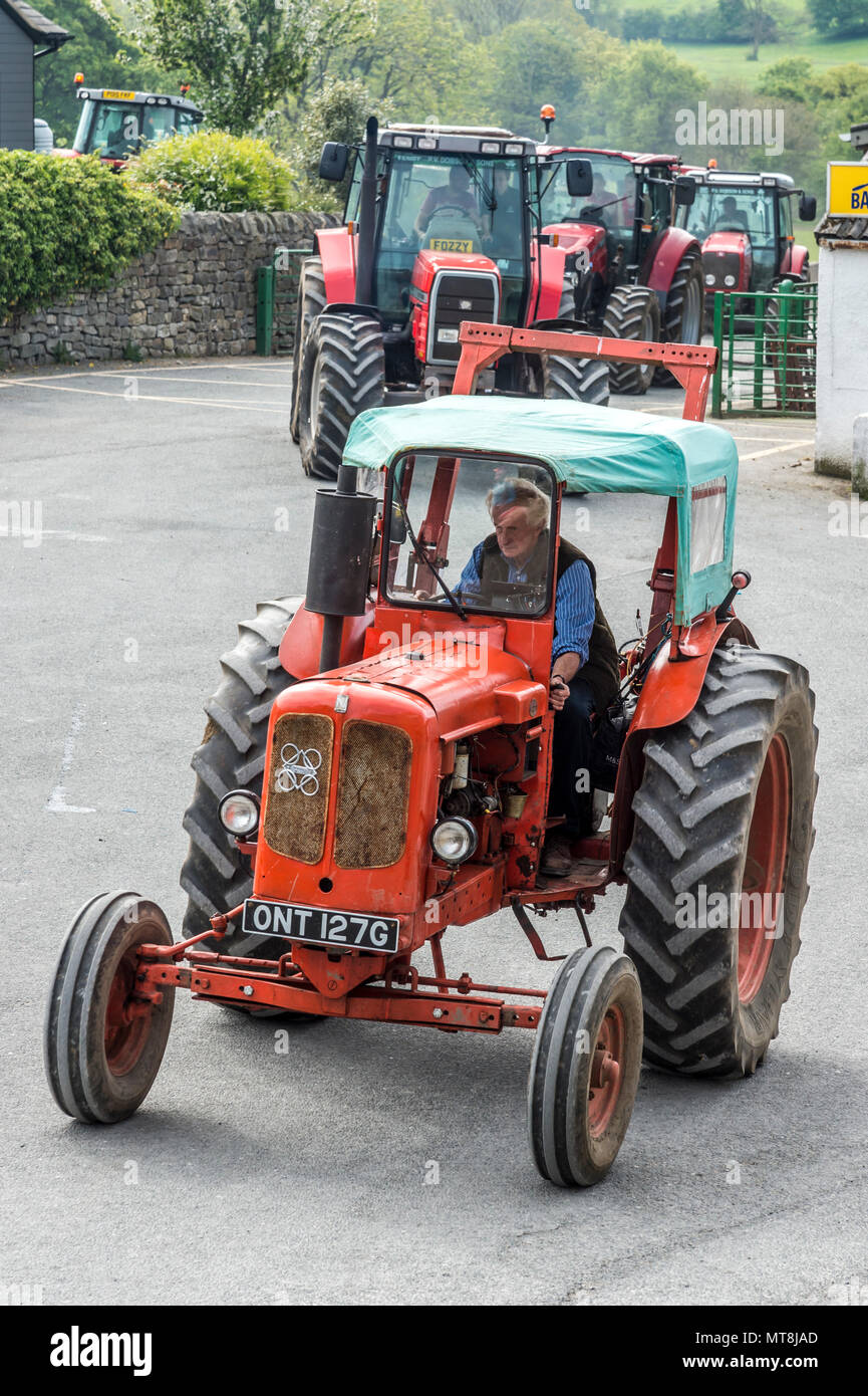 The annual charity vintage tractor rally leaving the live-stock auction ...