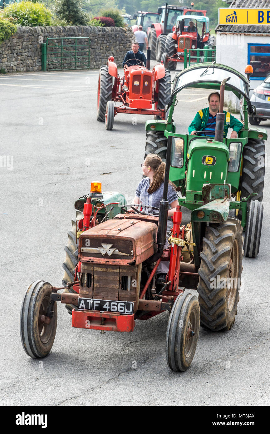 The annual charity vintage tractor rally leaving the live-stock auction ...
